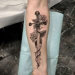 Rose and Dagger Tattoo Meaning & Why It’s So Iconic